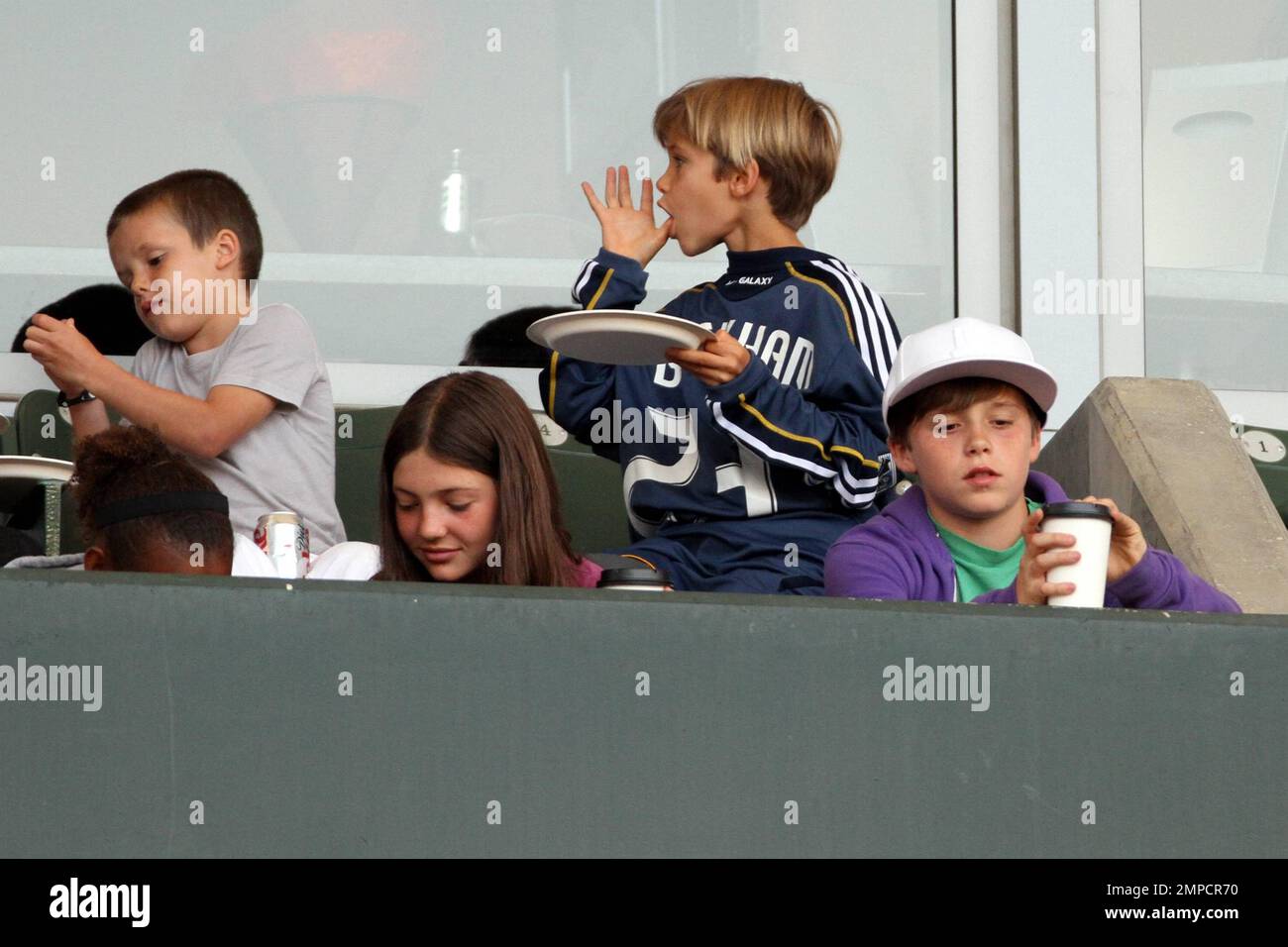 David Beckham's sons and their friends enjoy snacks while supporting ...