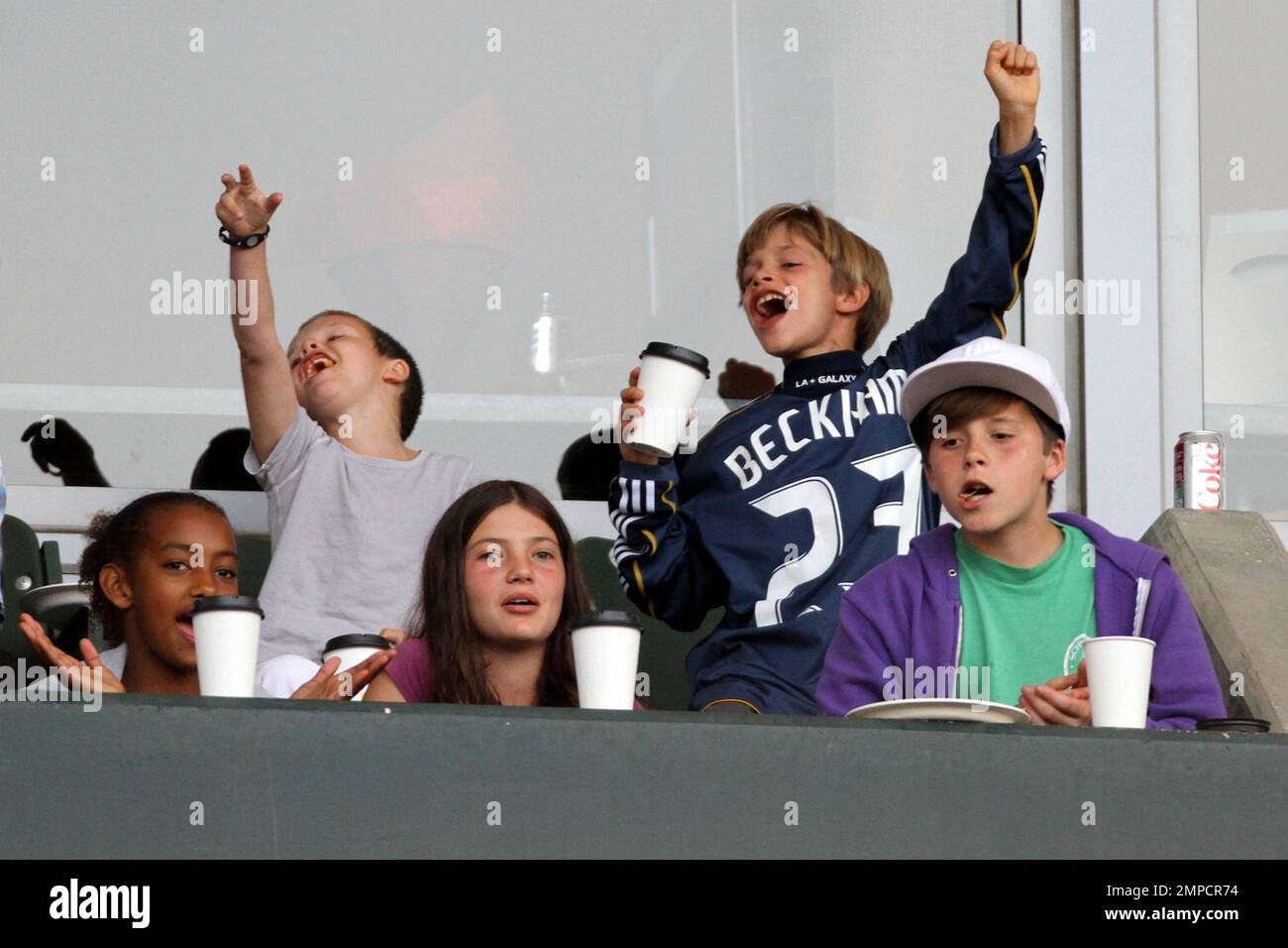David Beckham's sons and their friends enjoy snacks while supporting ...