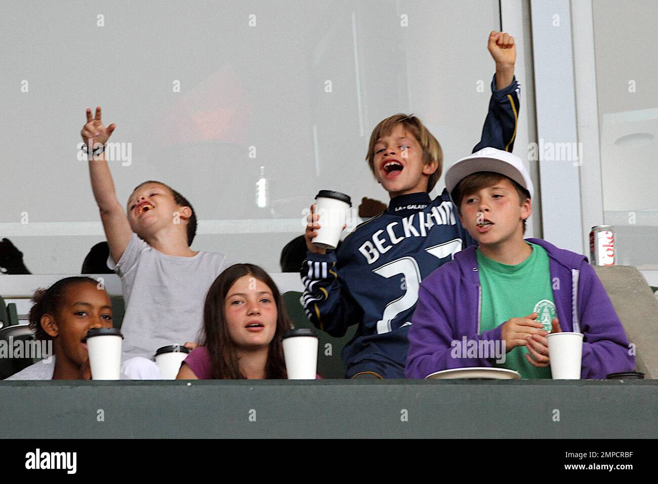David Beckham's sons and their friends enjoy snacks while supporting ...