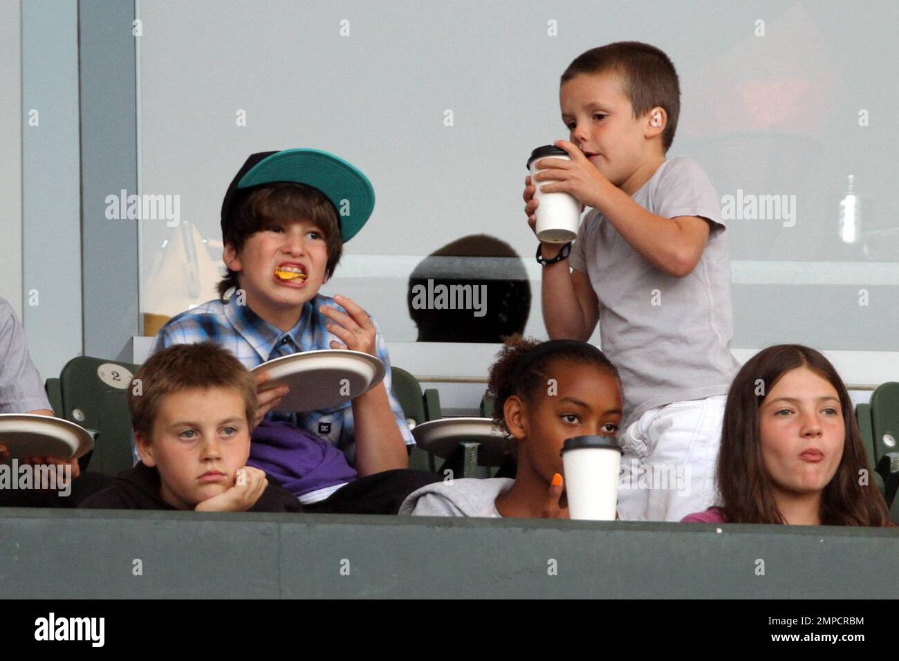 David Beckham's sons and their friends enjoy snacks while supporting ...