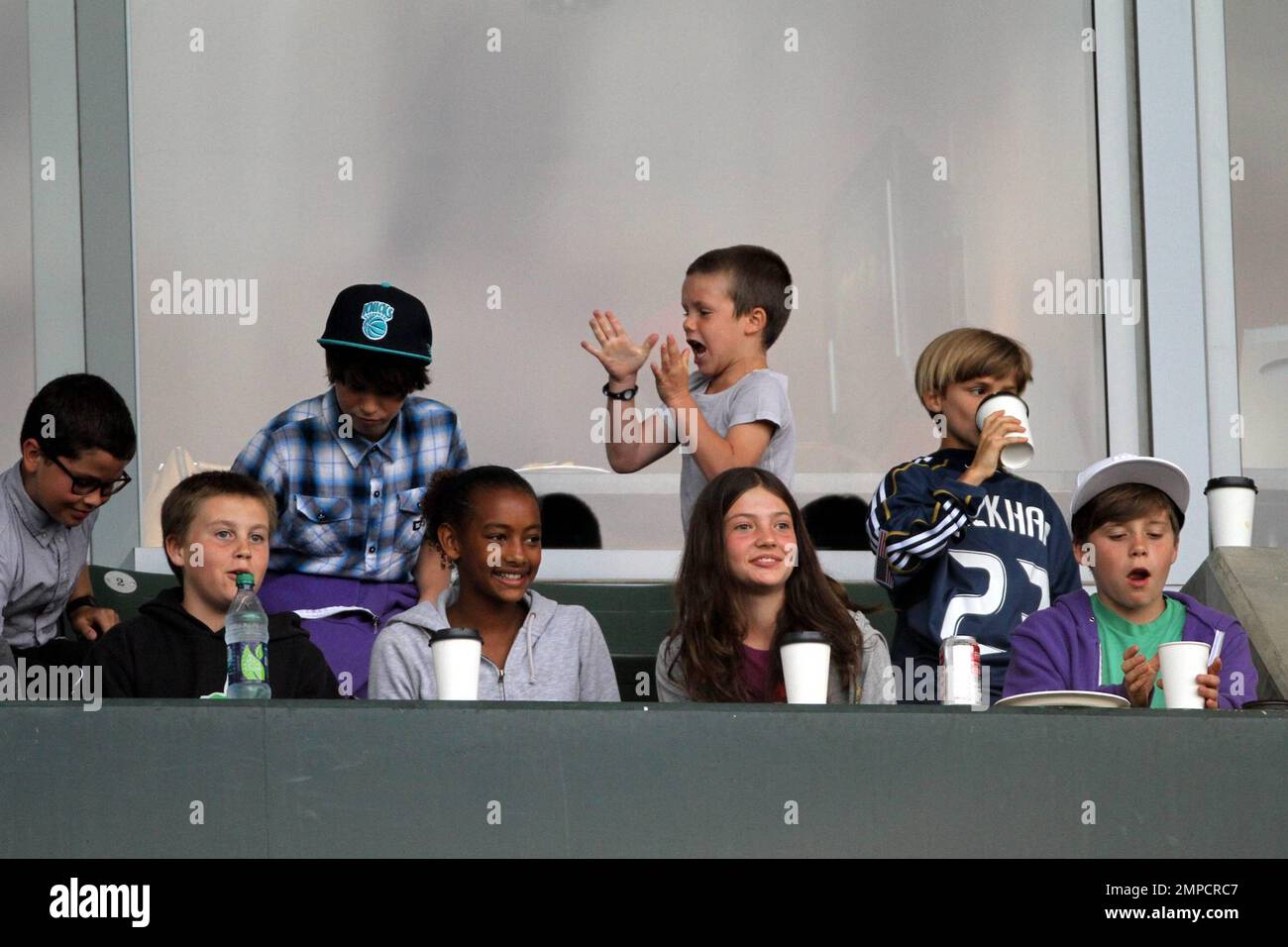 David Beckham's sons and their friends enjoy snacks while supporting ...
