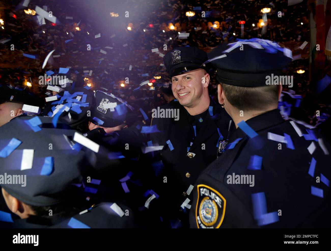 New police officers celebrate their graduation during a ceremony at the ...