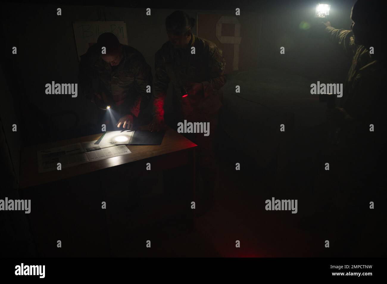 U.S. Air Force Airmen participate in a fire escape room exercise for ...