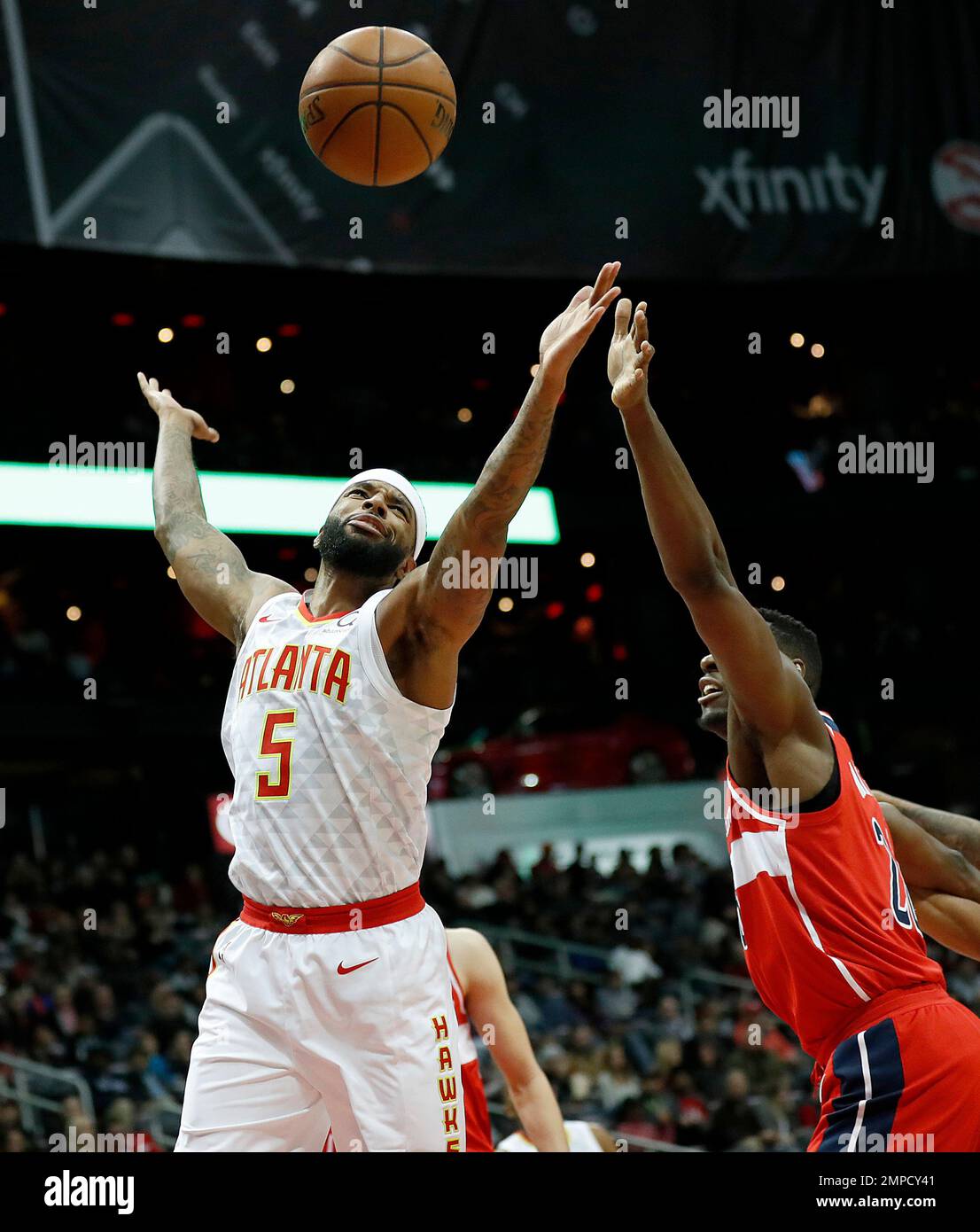 Atlanta Hawks' Malcolm Delaney, left, is fouled by Washington Wizards ...