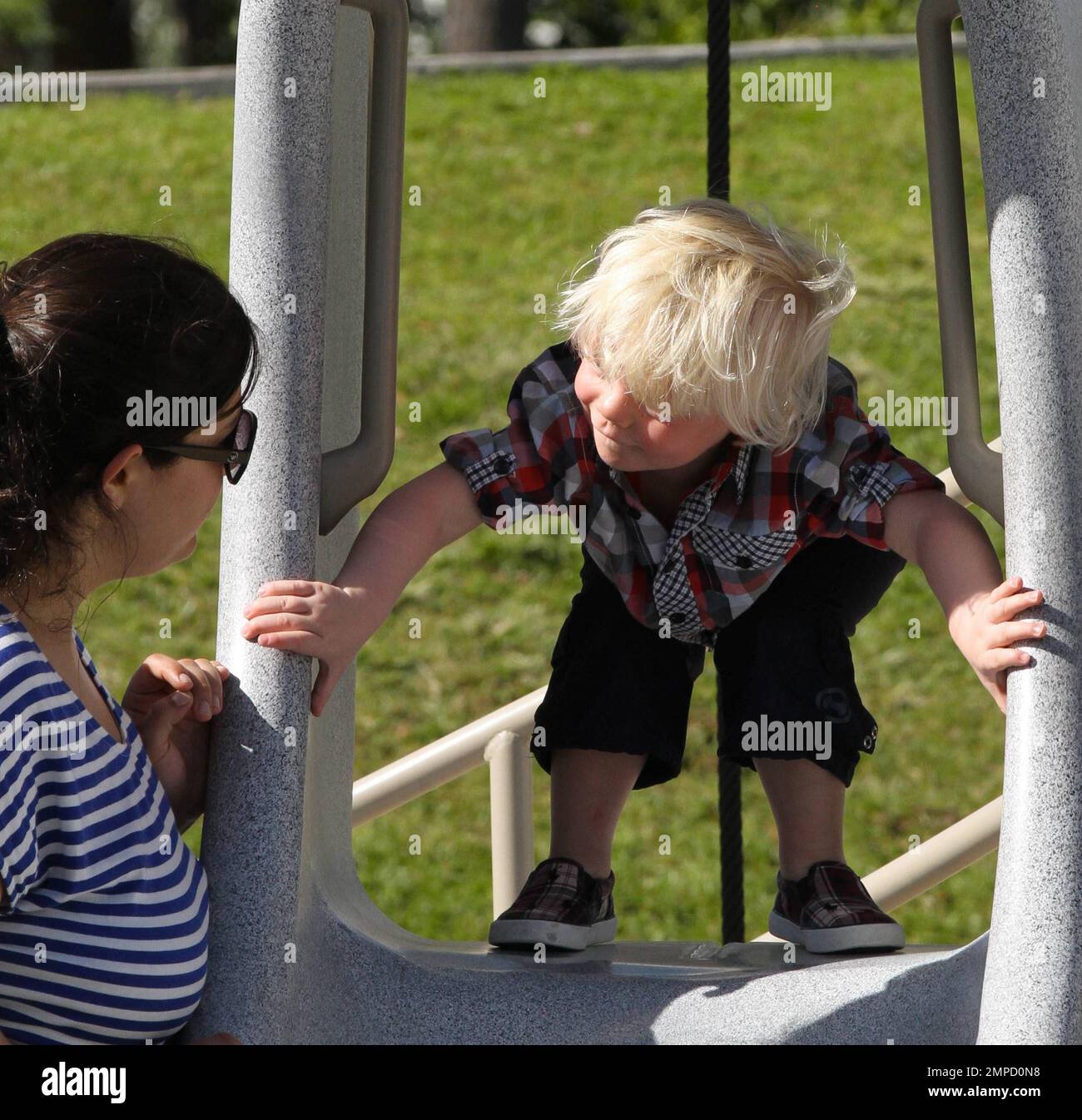 Amadeus Becker and mom Lily visit a kid's playground by the ocean where ...