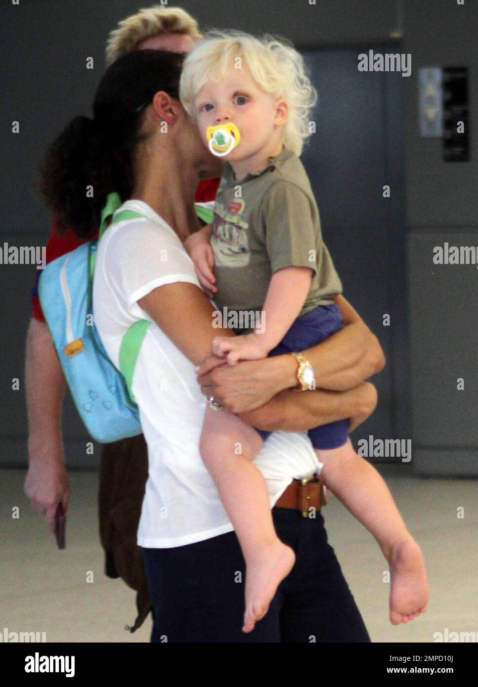Boris Becker makes his way through Miami International Airport with his ...