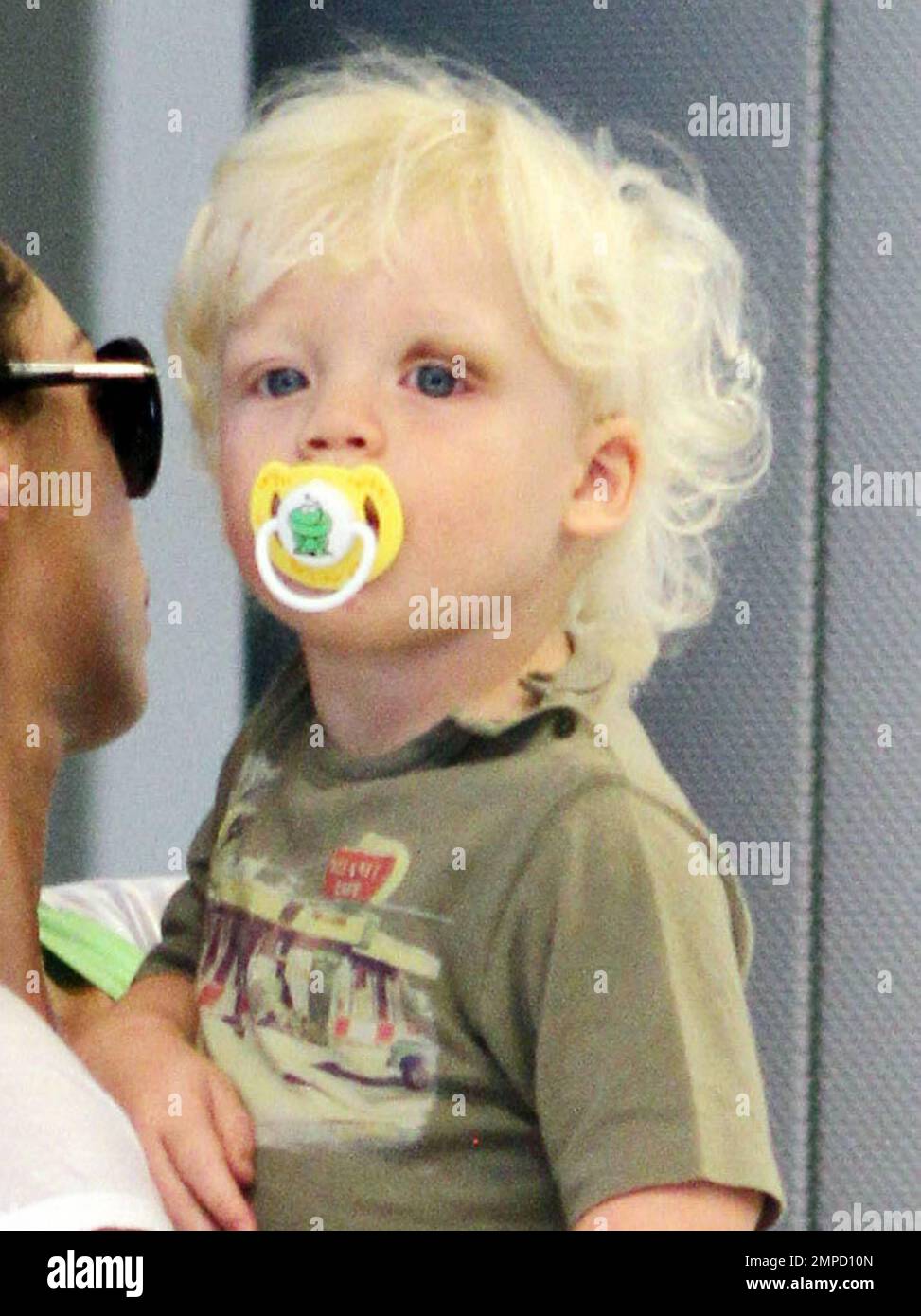 Boris Becker makes his way through Miami International Airport with his ...