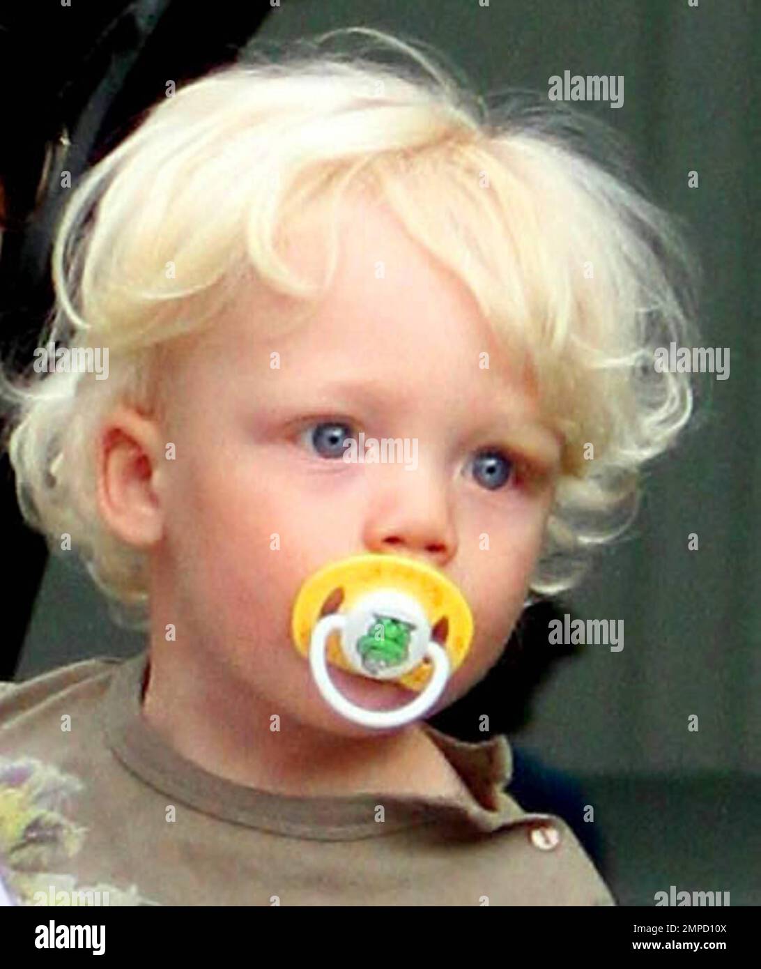 Boris Becker makes his way through Miami International Airport with his ...