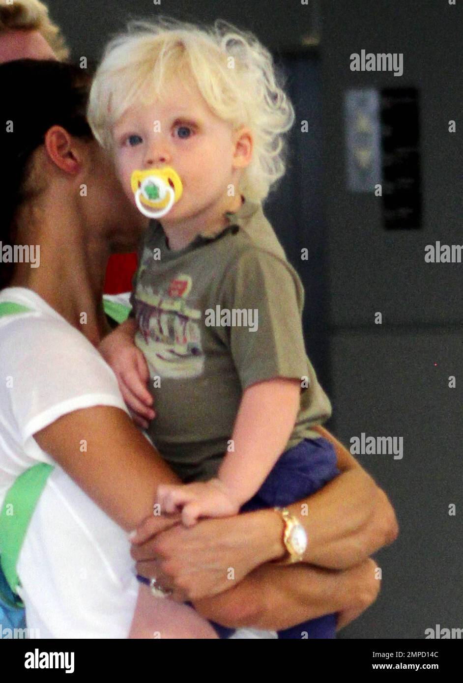 Boris Becker makes his way through Miami International Airport with his ...