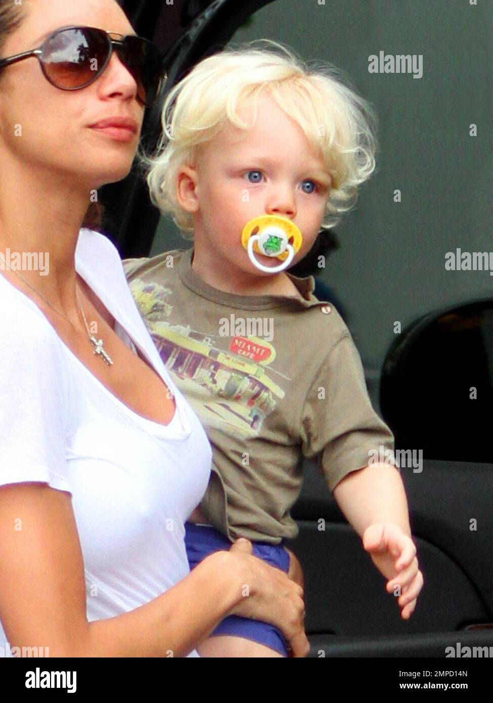 Boris Becker makes his way through Miami International Airport with his ...