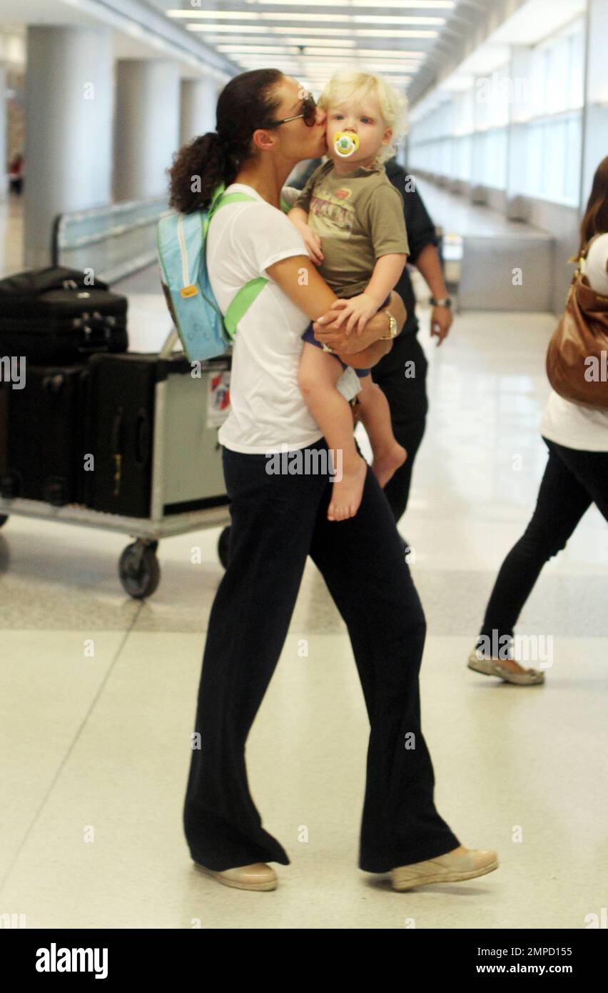 Boris Becker makes his way through Miami International Airport with his ...