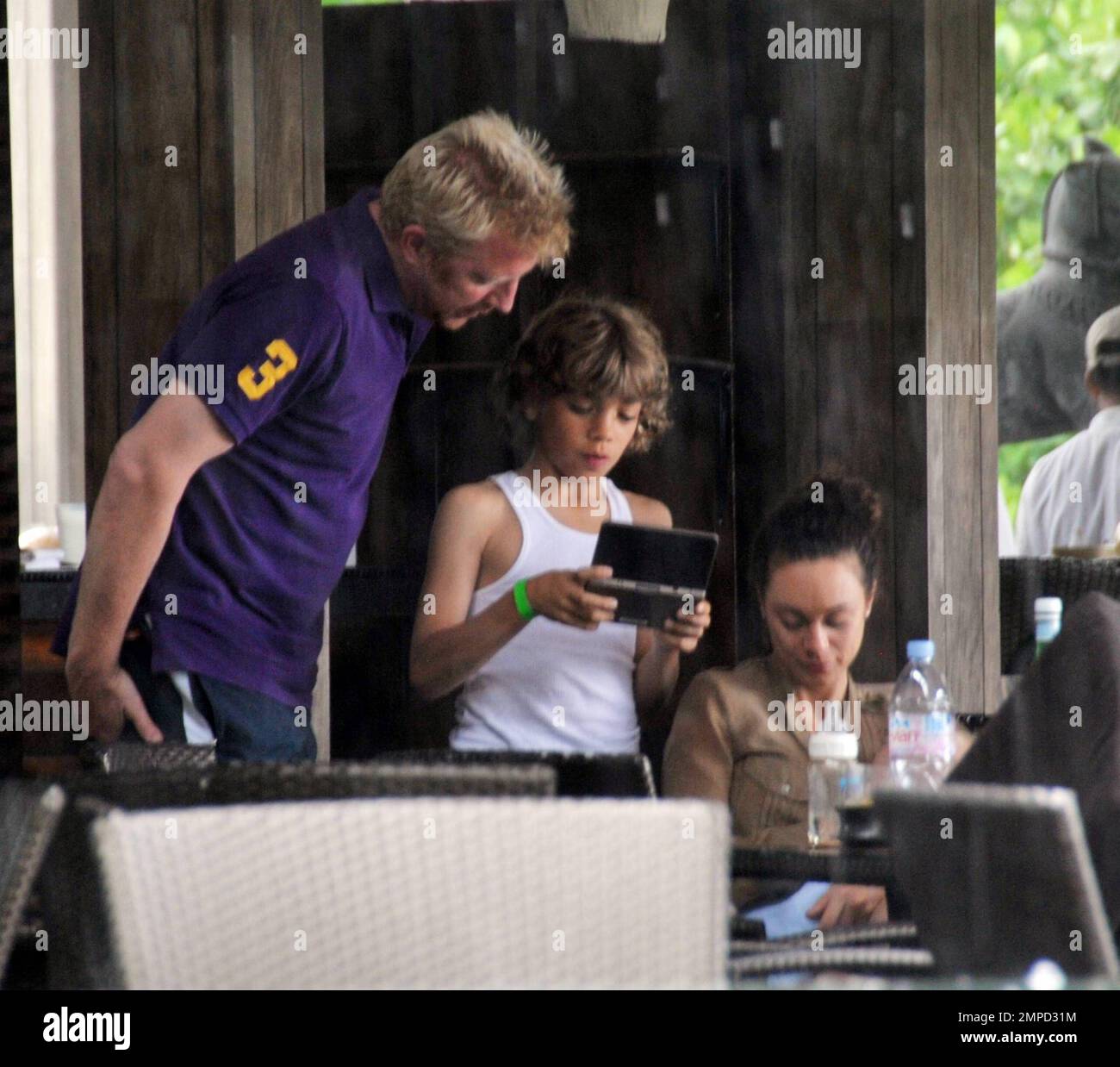 Boris Becker takes a walk in the rain with his wife Sharlely, son Elias ...