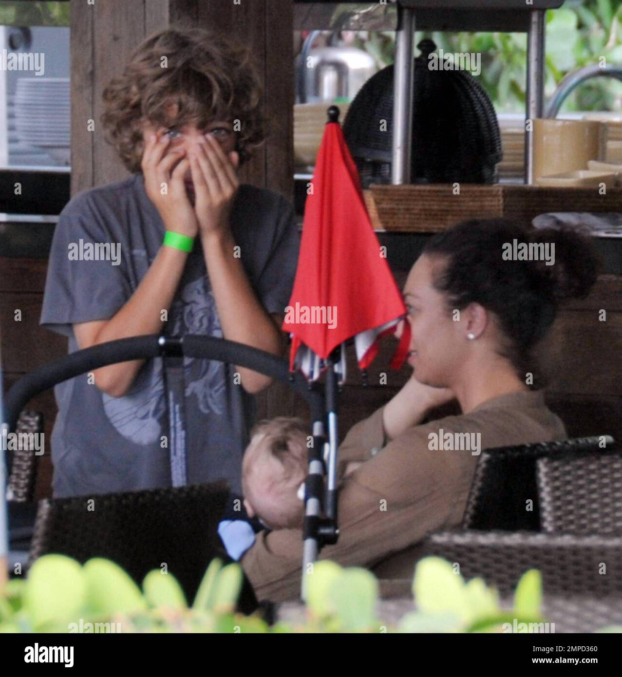 Boris Becker takes a walk in the rain with his wife Sharlely, son Elias ...