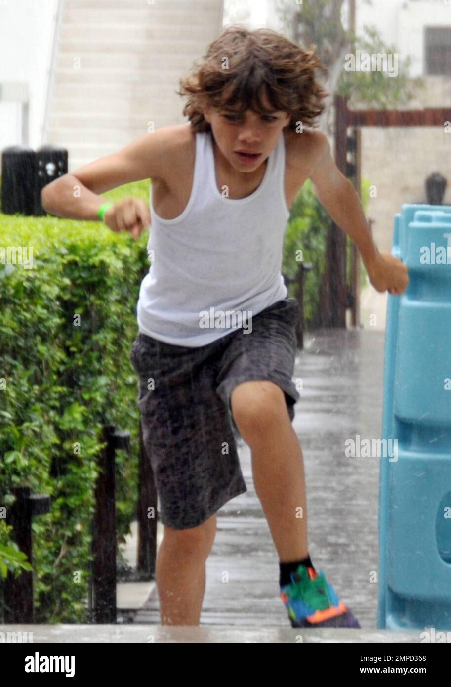 Boris Becker takes a walk in the rain with his wife Sharlely, son Elias ...