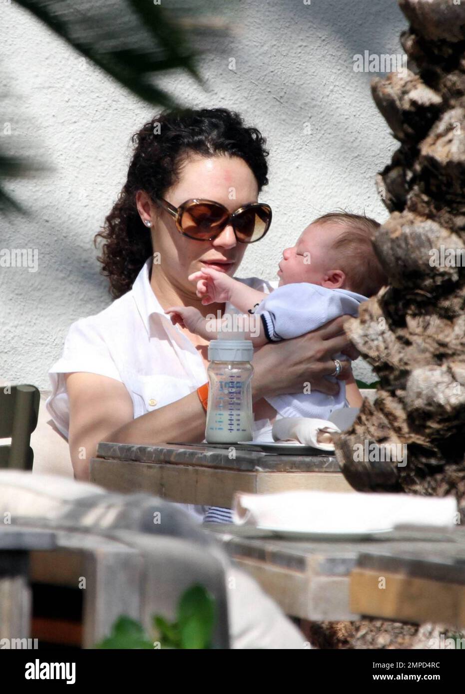 Tennis ace Boris Becker walks along Miami Beach boardwalk yawning and ...