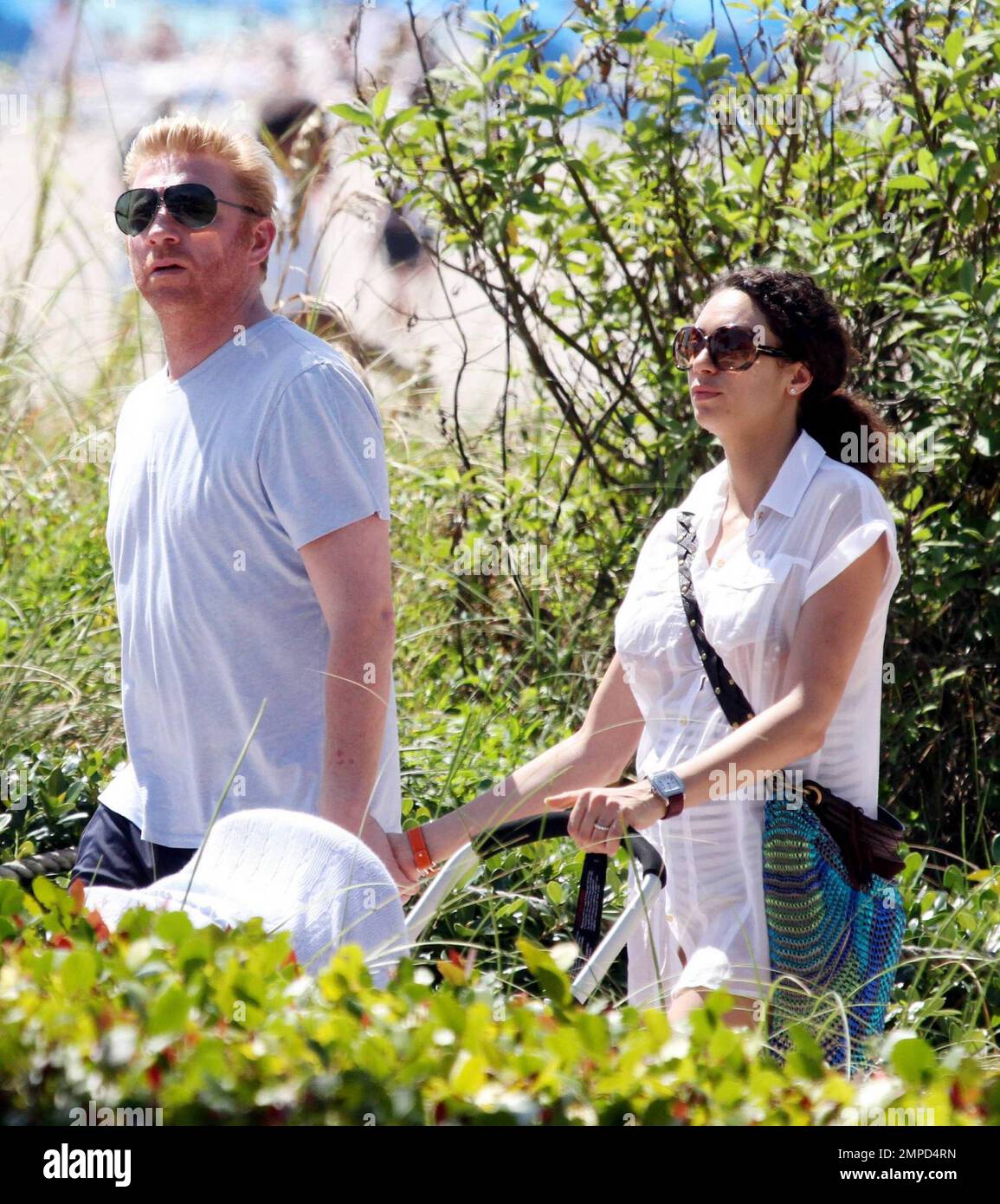 Tennis ace Boris Becker walks along Miami Beach boardwalk yawning and ...