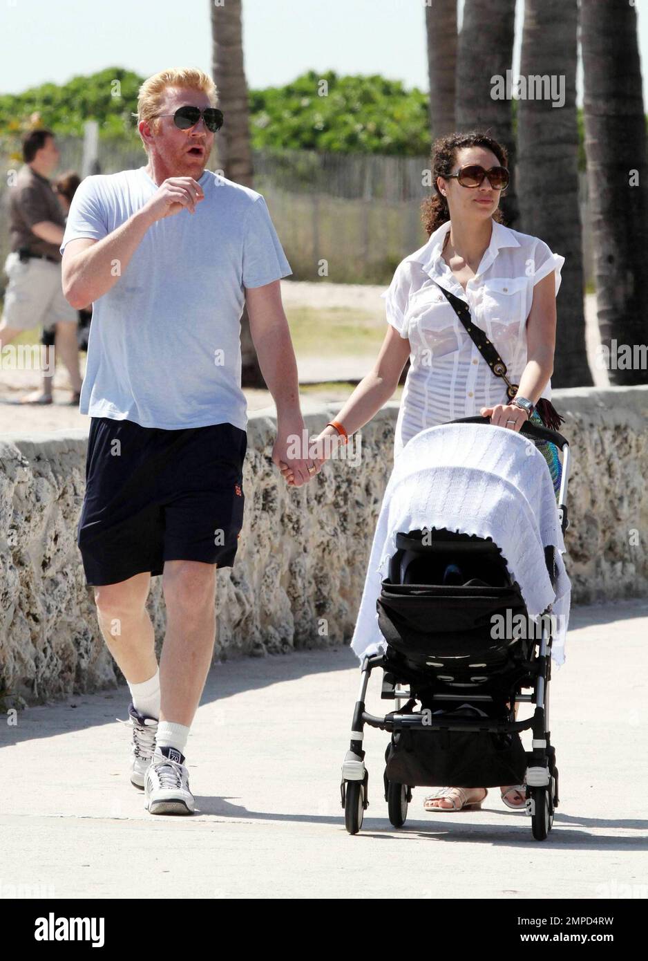 Tennis ace Boris Becker walks along Miami Beach boardwalk yawning and ...