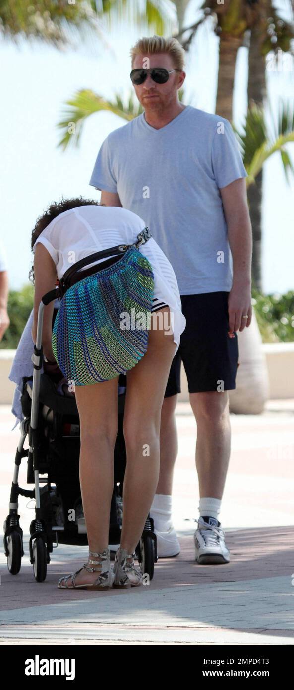 Tennis ace Boris Becker walks along Miami Beach boardwalk yawning and ...