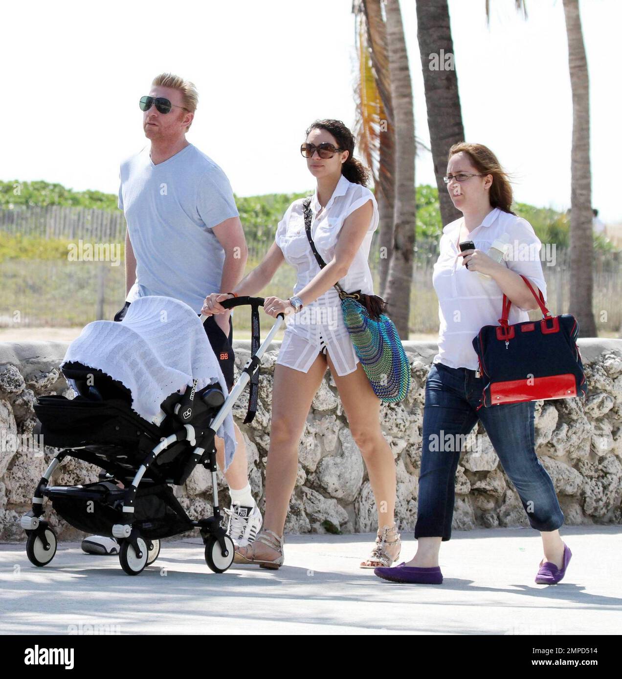 Tennis ace Boris Becker walks along Miami Beach boardwalk yawning and ...
