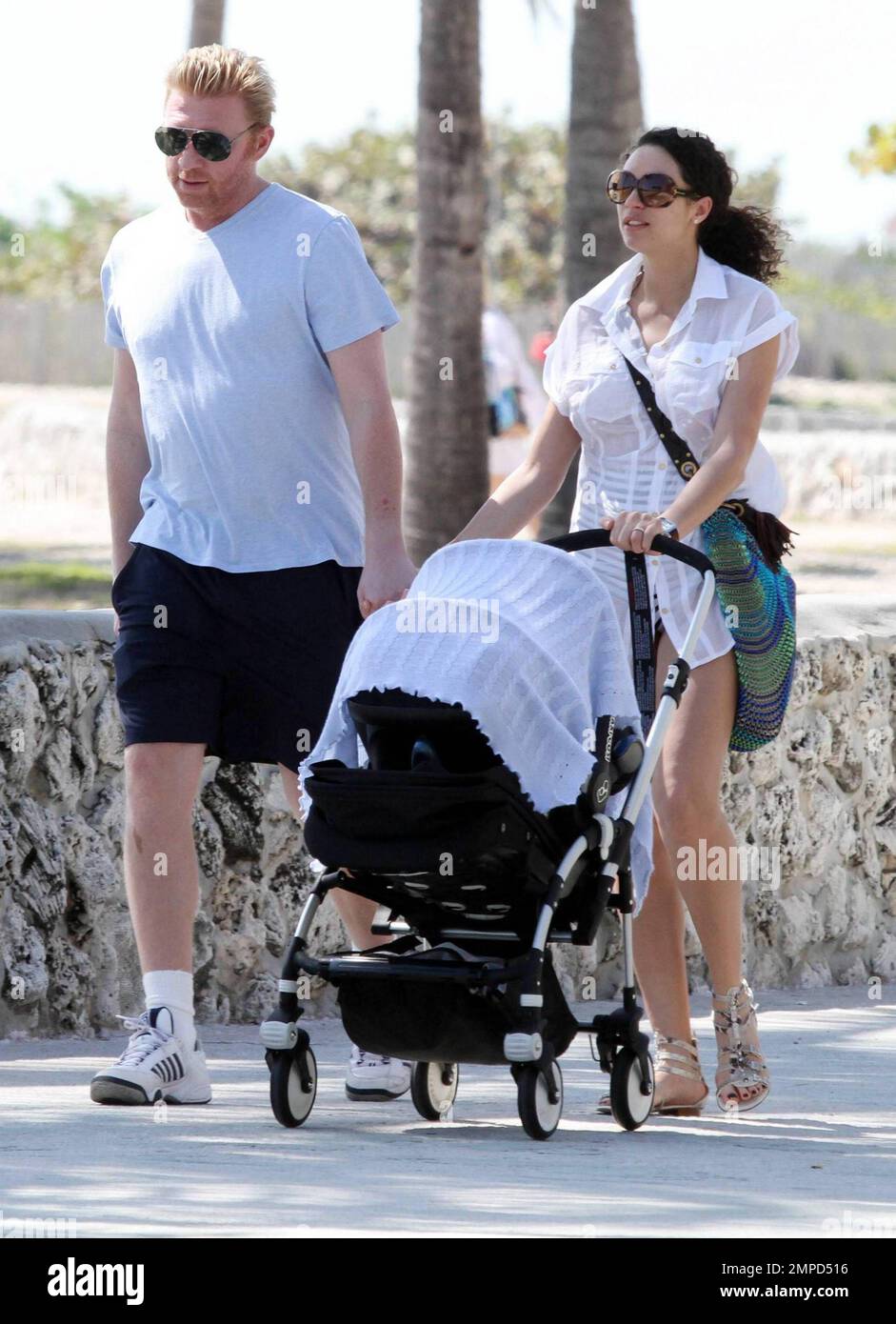 Tennis ace Boris Becker walks along Miami Beach boardwalk yawning and ...