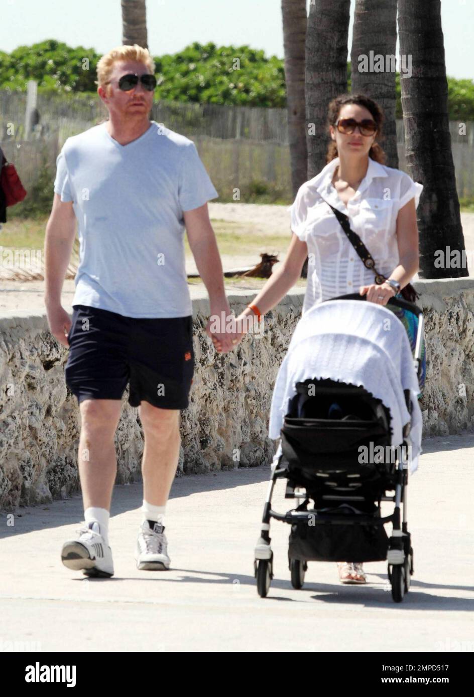 Tennis ace Boris Becker walks along Miami Beach boardwalk yawning and ...