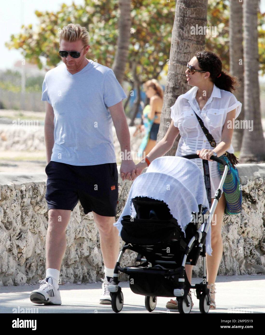 Tennis ace Boris Becker walks along Miami Beach boardwalk yawning and ...