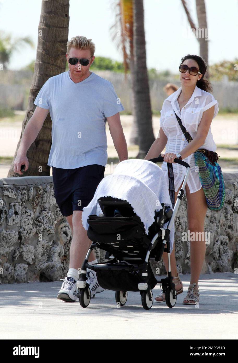 Tennis ace Boris Becker walks along Miami Beach boardwalk yawning and ...