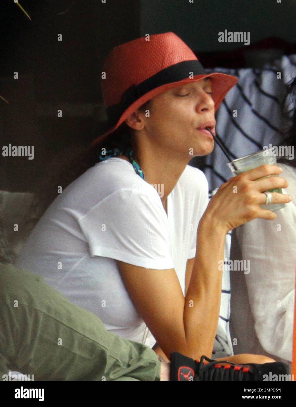 The Becker family lunch at a beachside hotel pool with pals. Boris and ...