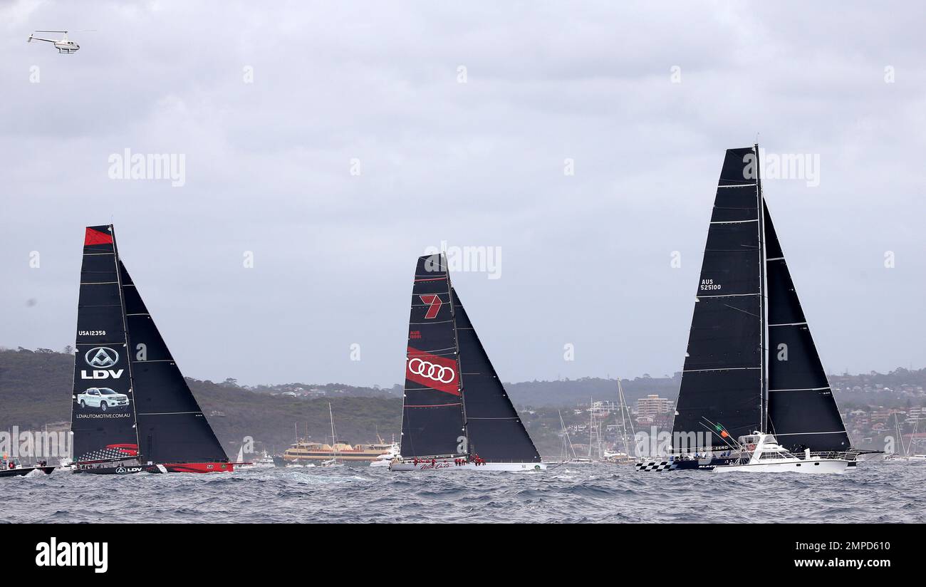 The supermaxis Black Jack, right, Wild Oats XI and LDV Comanche, left ...