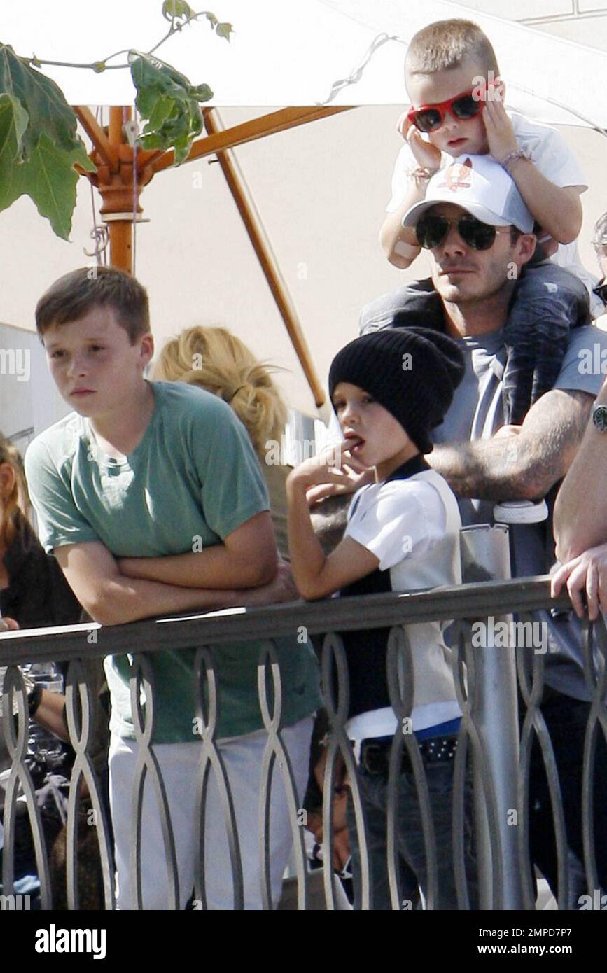 Footballer David Beckham, wife Victoria and their three sons Brooklyn ...