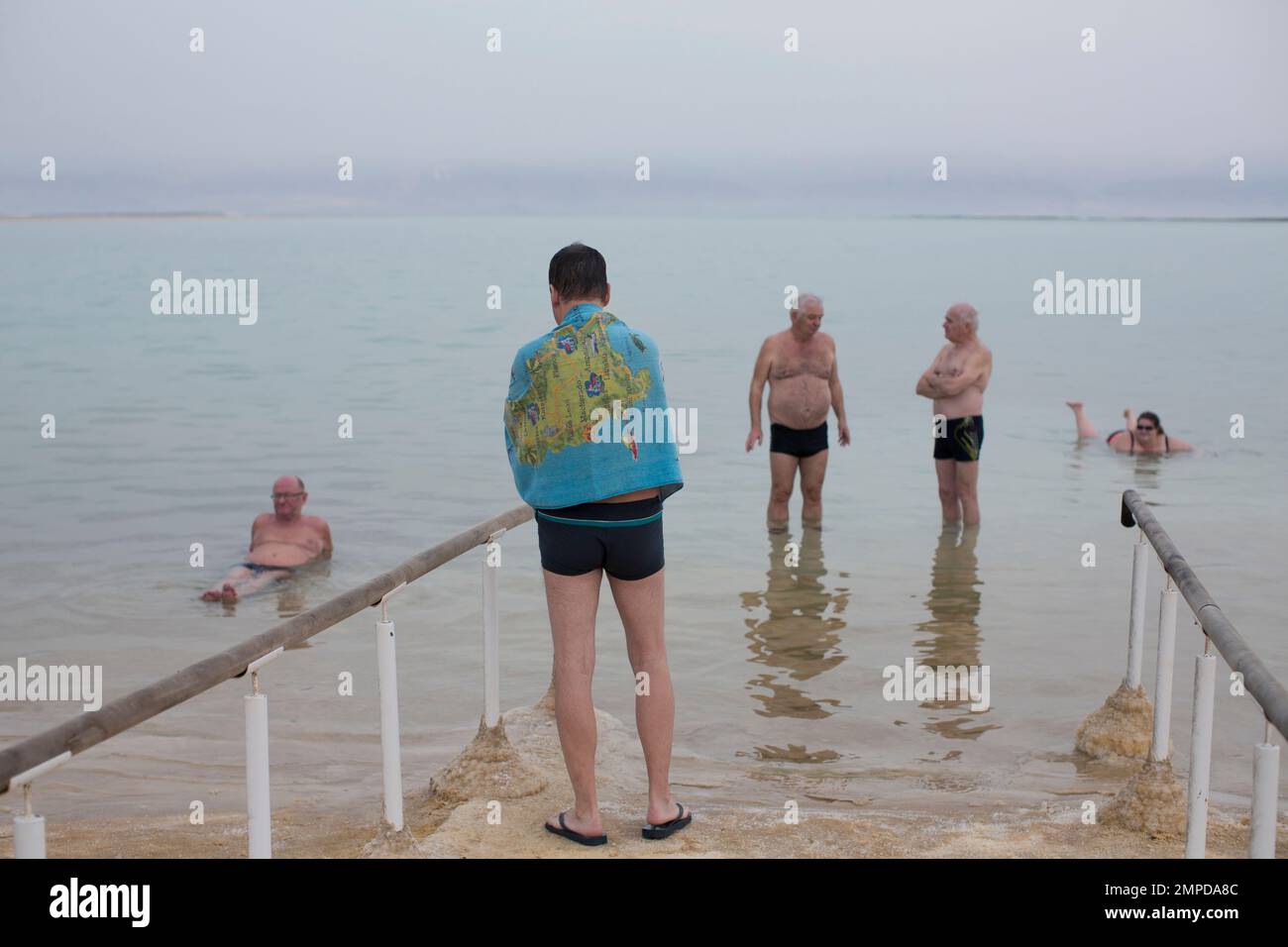 In this Wednesday, Jan. 25, 2017 photo, people bathe in the Dead Sea at the Ein Bokek resort ...