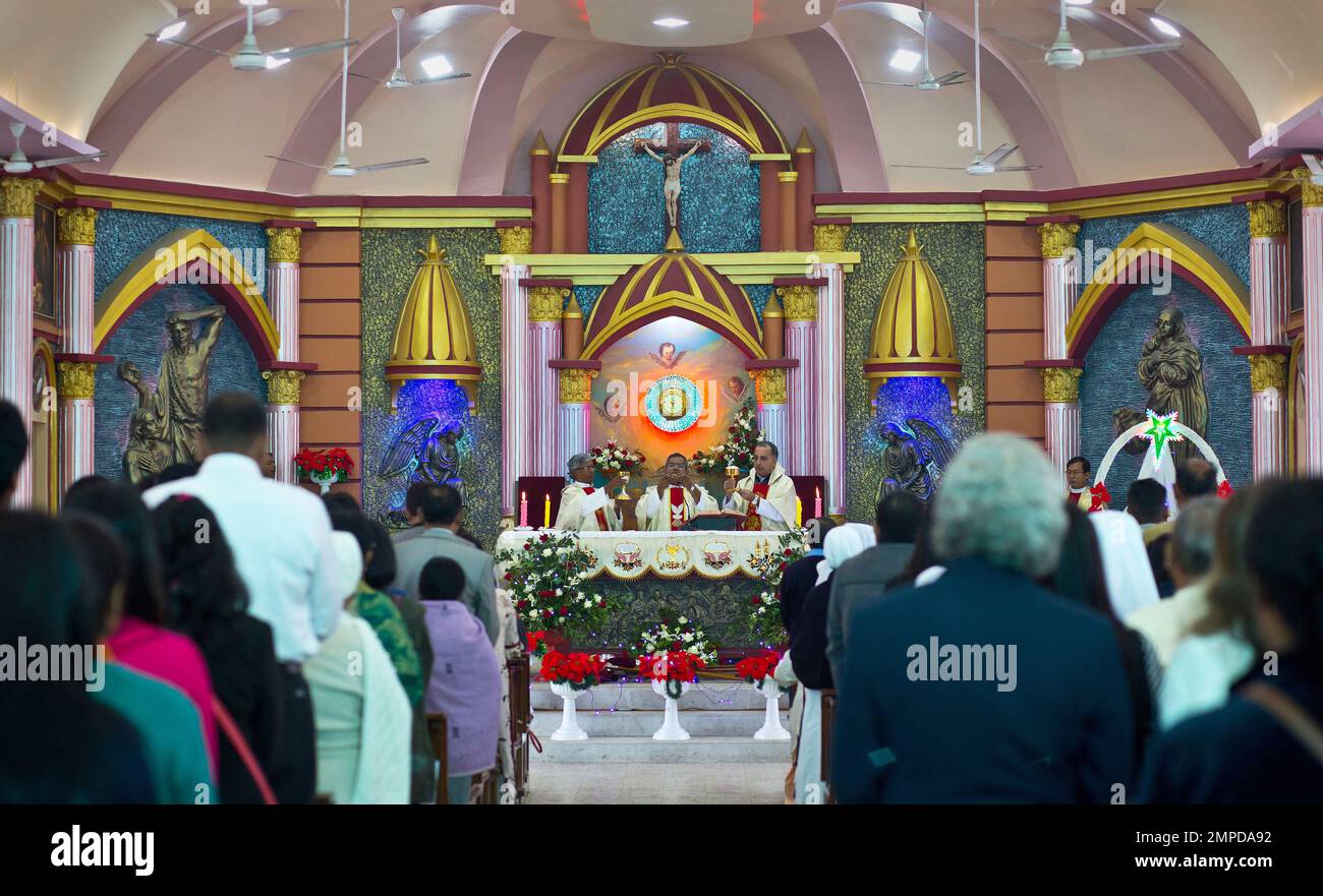 Indian priests conduct Christmas prayers at a Church in Gauhati, India ...