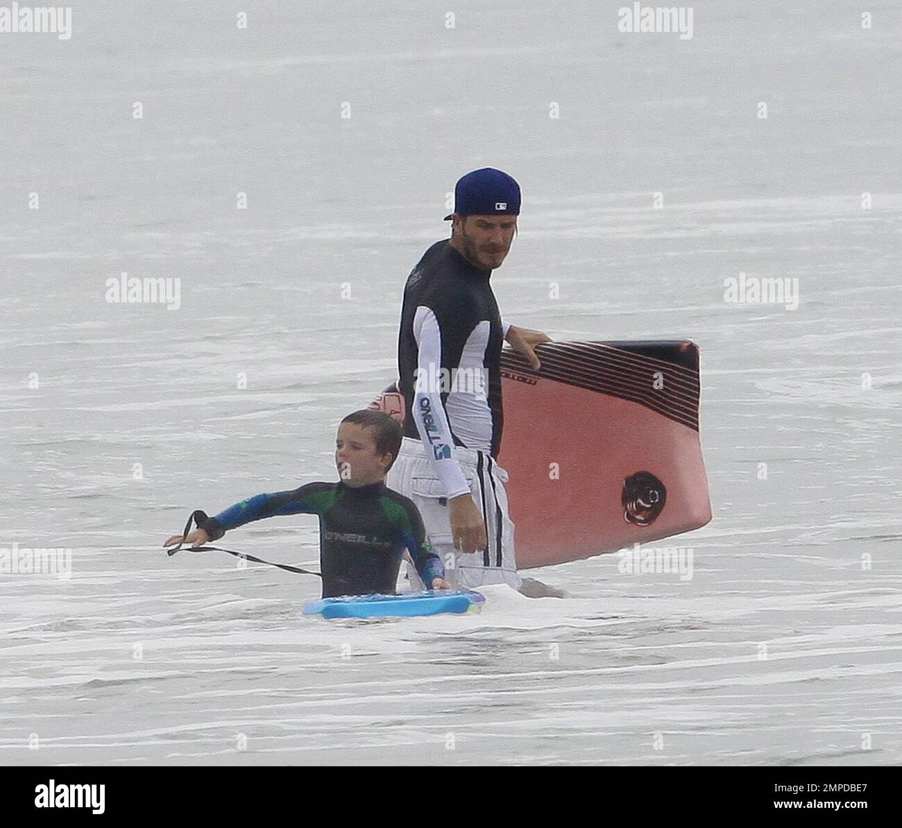 UK soccer star David Beckham takes his sons body-boarding in Malibu, CA ...
