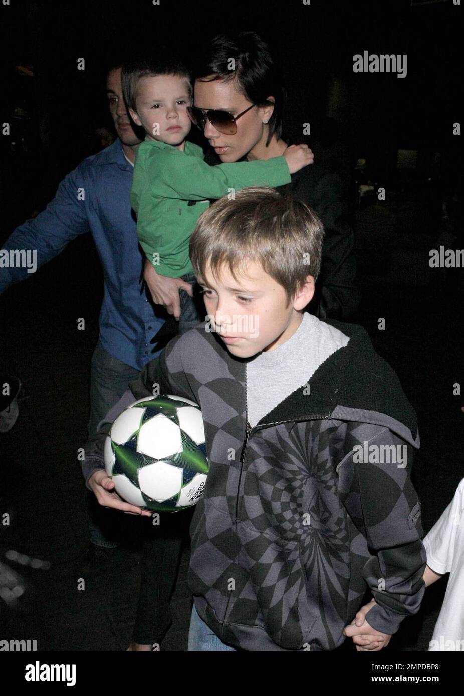 Victoria Beckham and her three sons Brooklyn, Romeo and Cruz arrive at ...