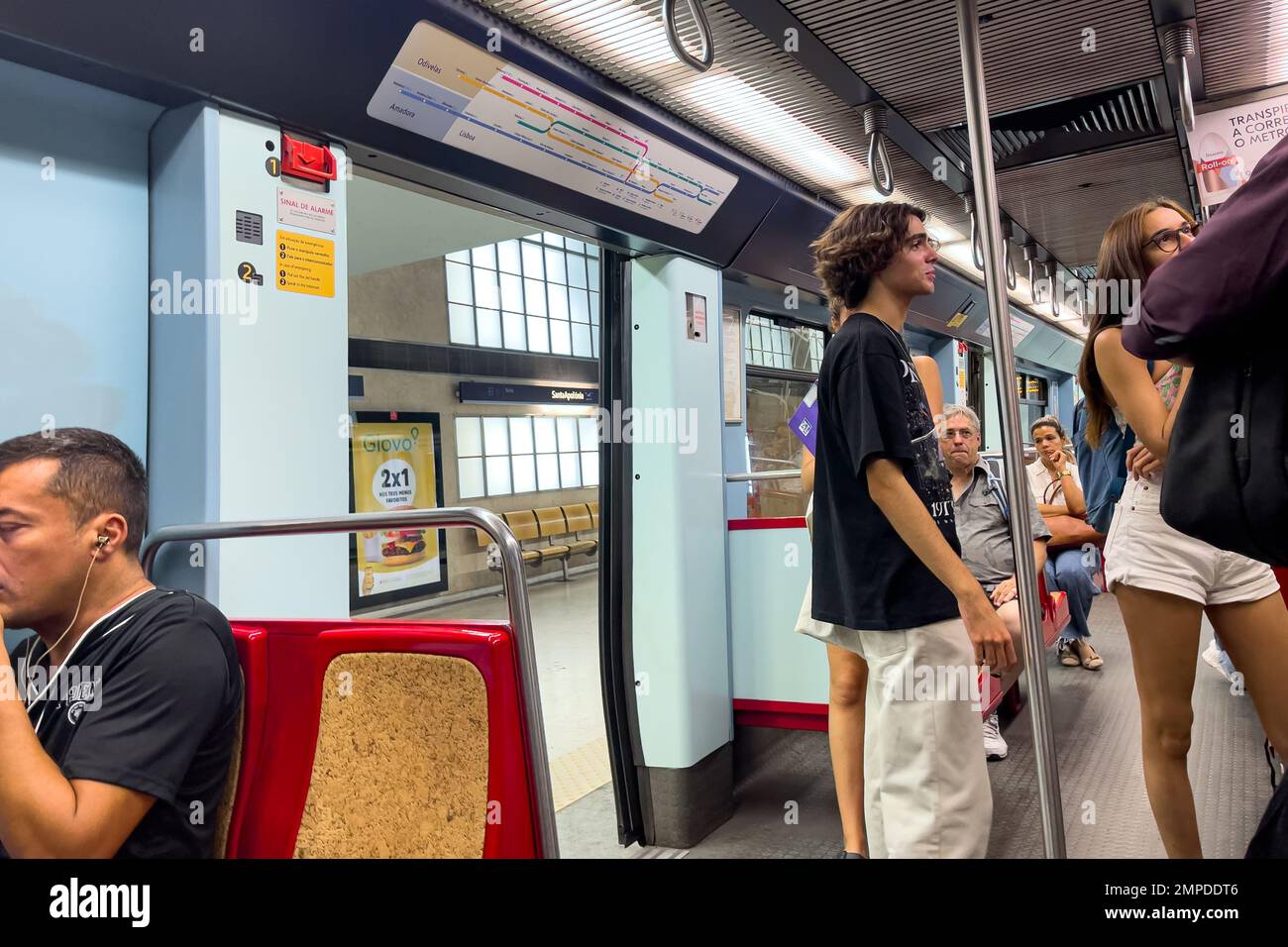 Passengers taking a ride in the metro Stock Photo - Alamy