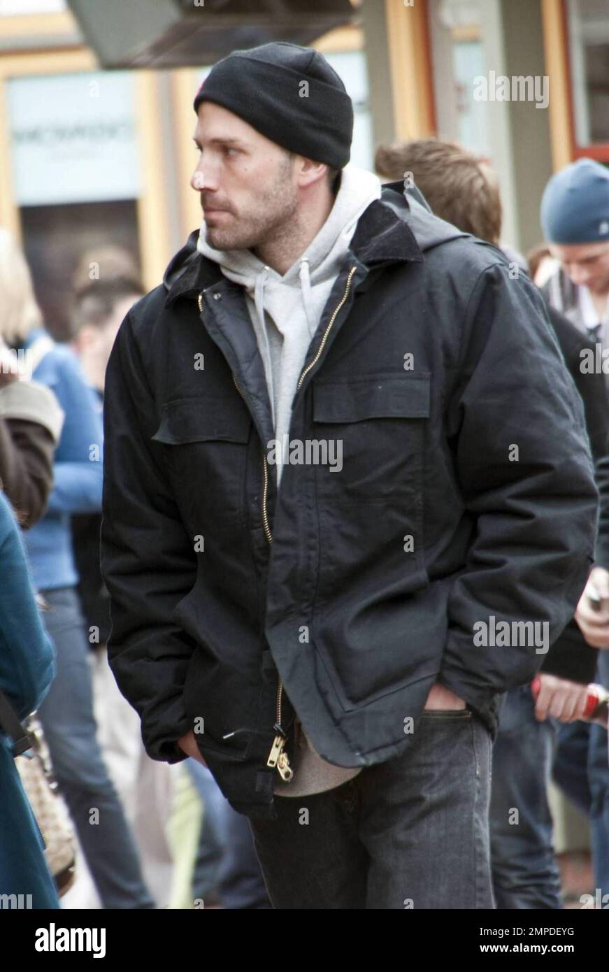 Ben Affleck bundles up in a warm jacket and a hat with his initial on ...