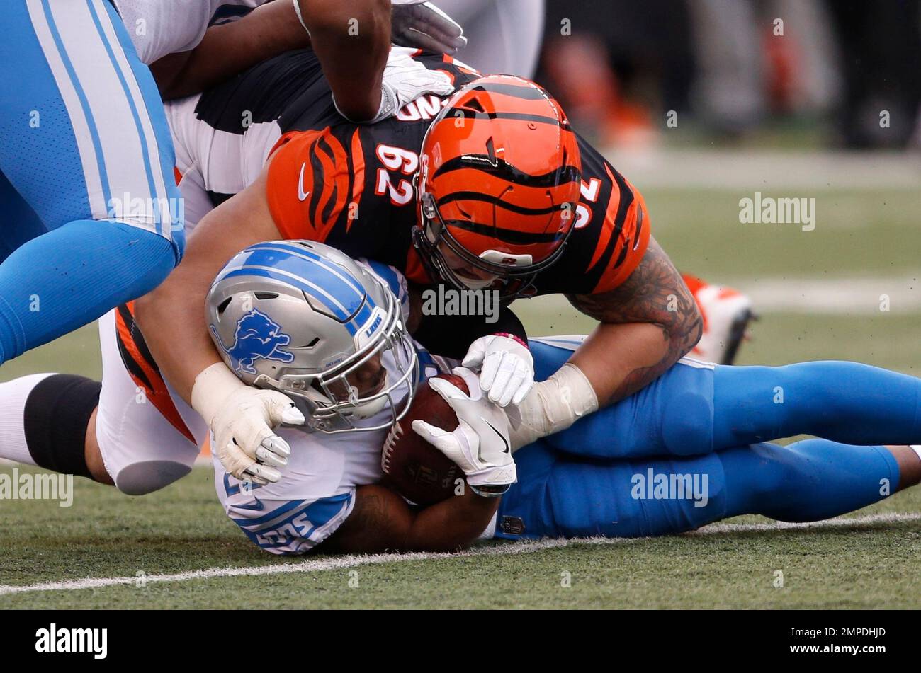 Cincinnati Bengals offensive guard Alex Redmond (62) falls on Detroit ...
