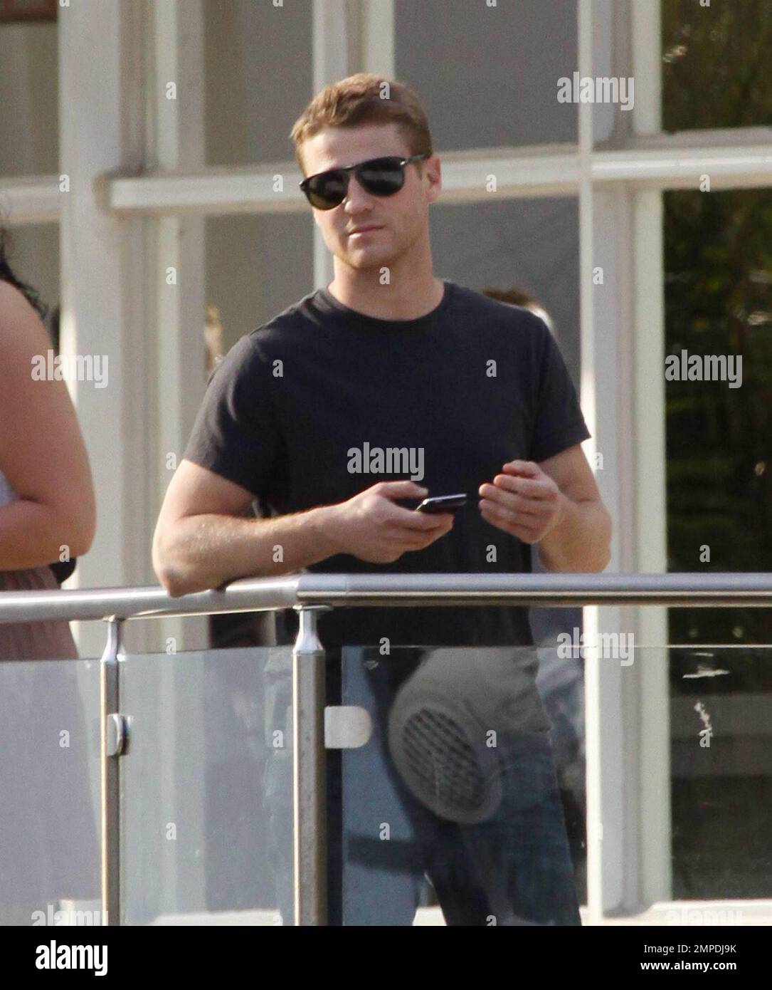 OC Actor Benjamin McKenzie checked his phone while enjoying the Miami ...