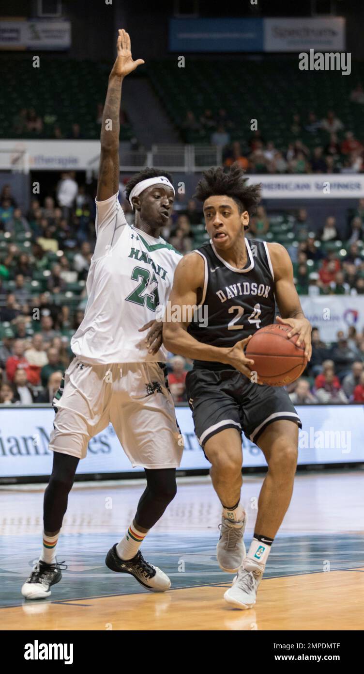 Davidson guard Carter Collins (24) attempts to drive to the basket but ...