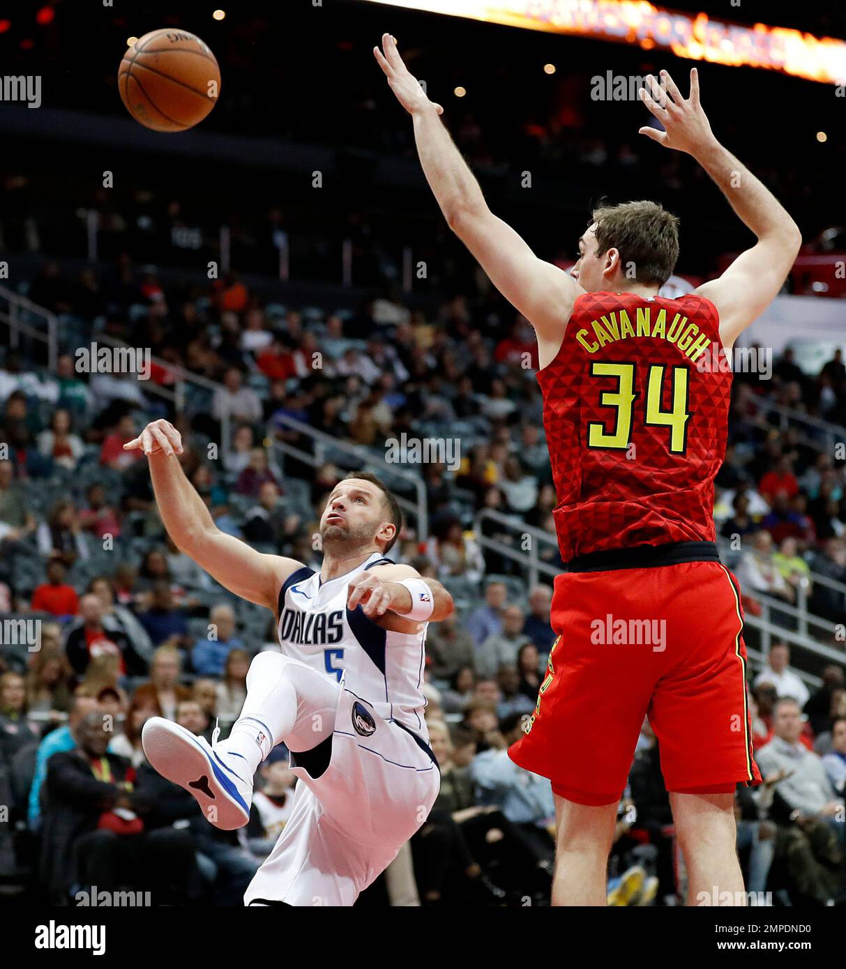 Dallas Mavericks' J.J. Barea, left, puts up a shot against Atlanta ...