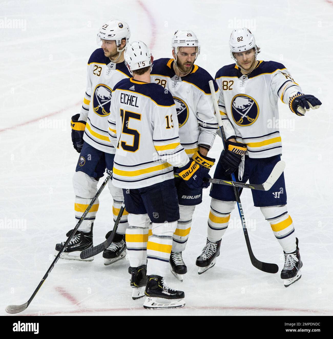 Buffalo Sabres' Nathan Beaulieu (82), Zemgus Girgensons (28), of Latvia ...