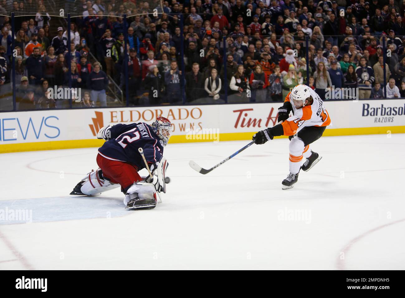 Columbus Blue Jackets' Sergei Bobrovsky, left, of Russia, makes a save ...