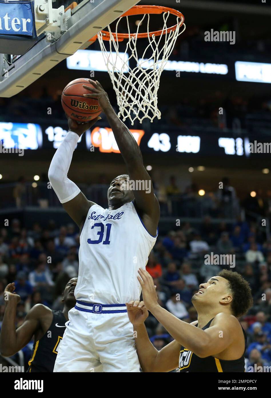 Seton Hall's Angel Delgado (31) takes a shot in front of Virginia ...
