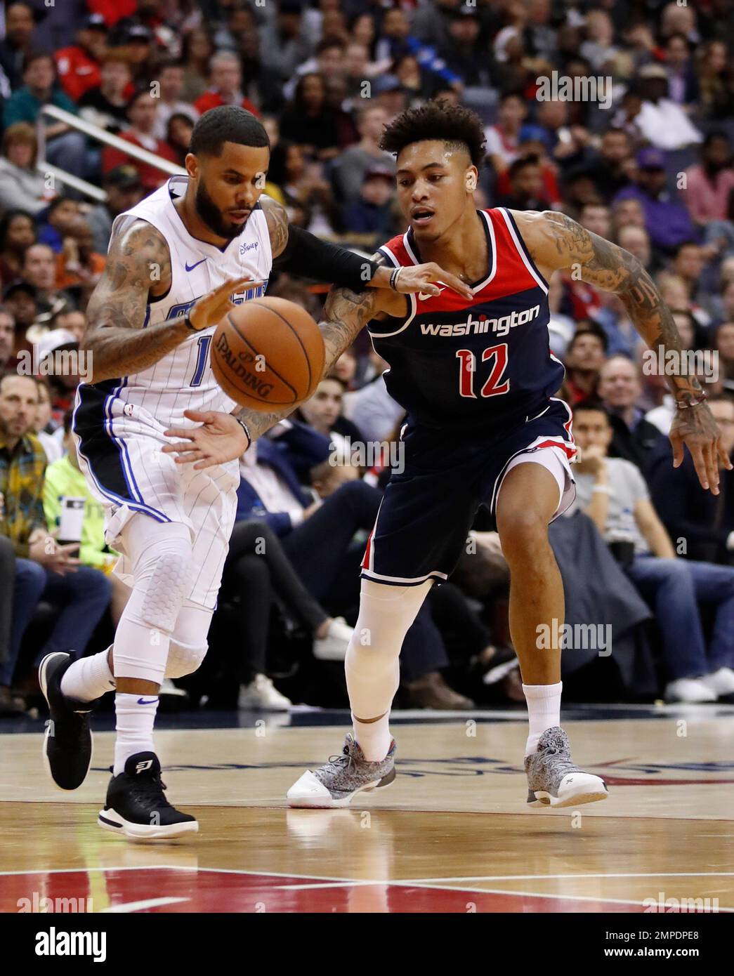 Orlando Magic guard D.J. Augustin, left, drives past Washington Wizards ...