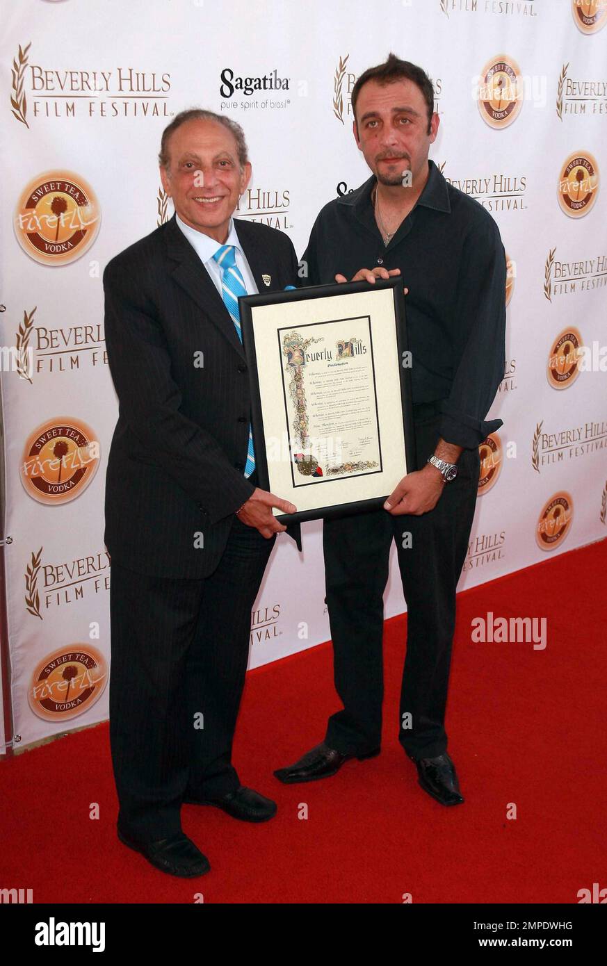 Mayor of Beverly Hills Jimmy Delshad and Nino Simone on the red carpet at the world premiere of ...