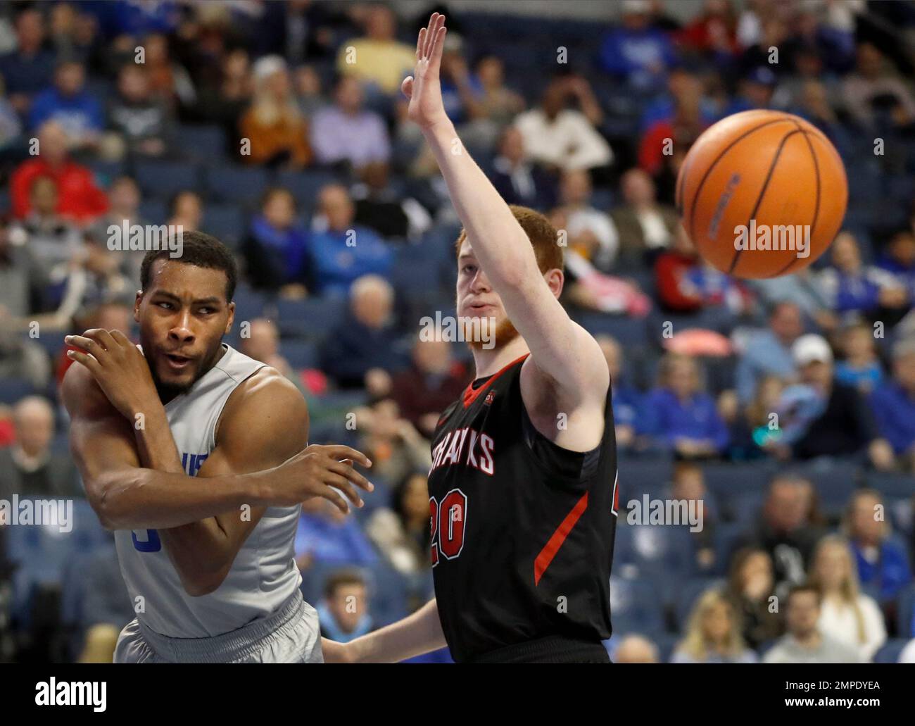 Saint Louis' Javon Bess, left, passes around Southeast Missouri State's ...