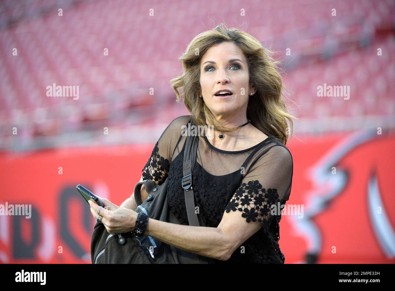 ESPN reporter Suzy Kolber walks on the field before an NFL football ...