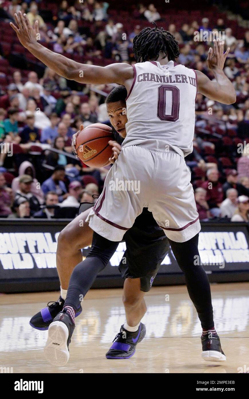 Buffalo guard Wes Clark (10) drives into Texas A&M guard Jay Jay ...