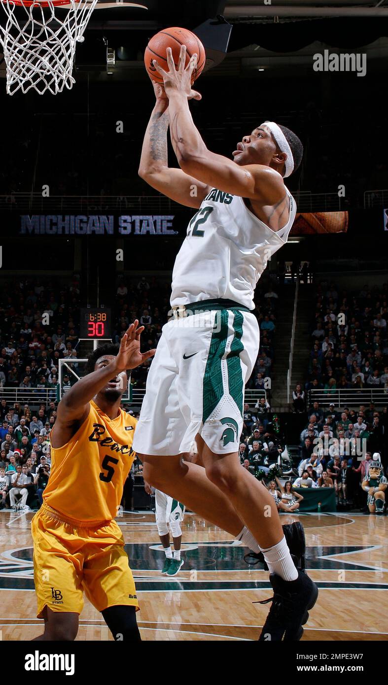 Michigan State's Miles Bridges, right, shoots against Long Beach State ...