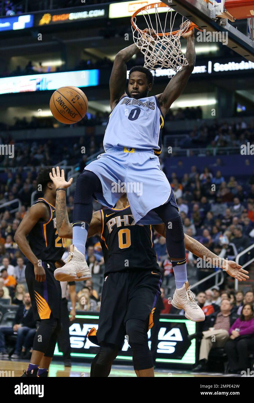Memphis Grizzlies JaMychal Green, top, dunks the ball over Phoenix Suns ...